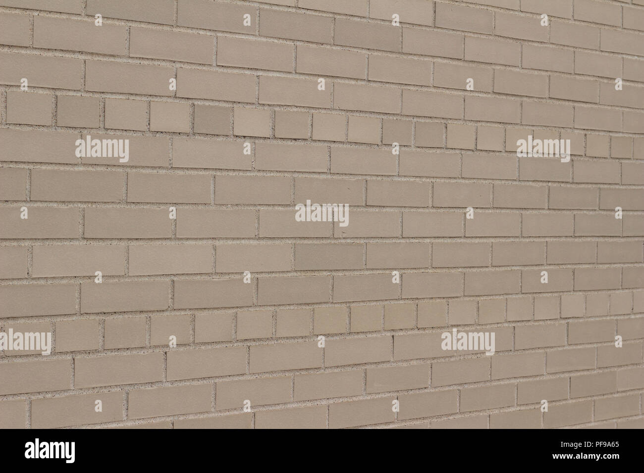 Attractive weathered light grey or beige brick wall background with a ...