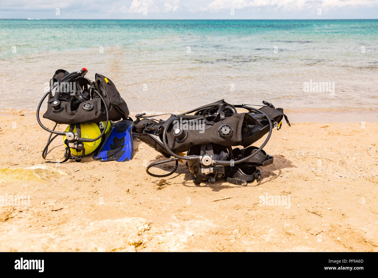 Equipment of a scuba diver, an oxygen balloon lies on the beach. Diving ...