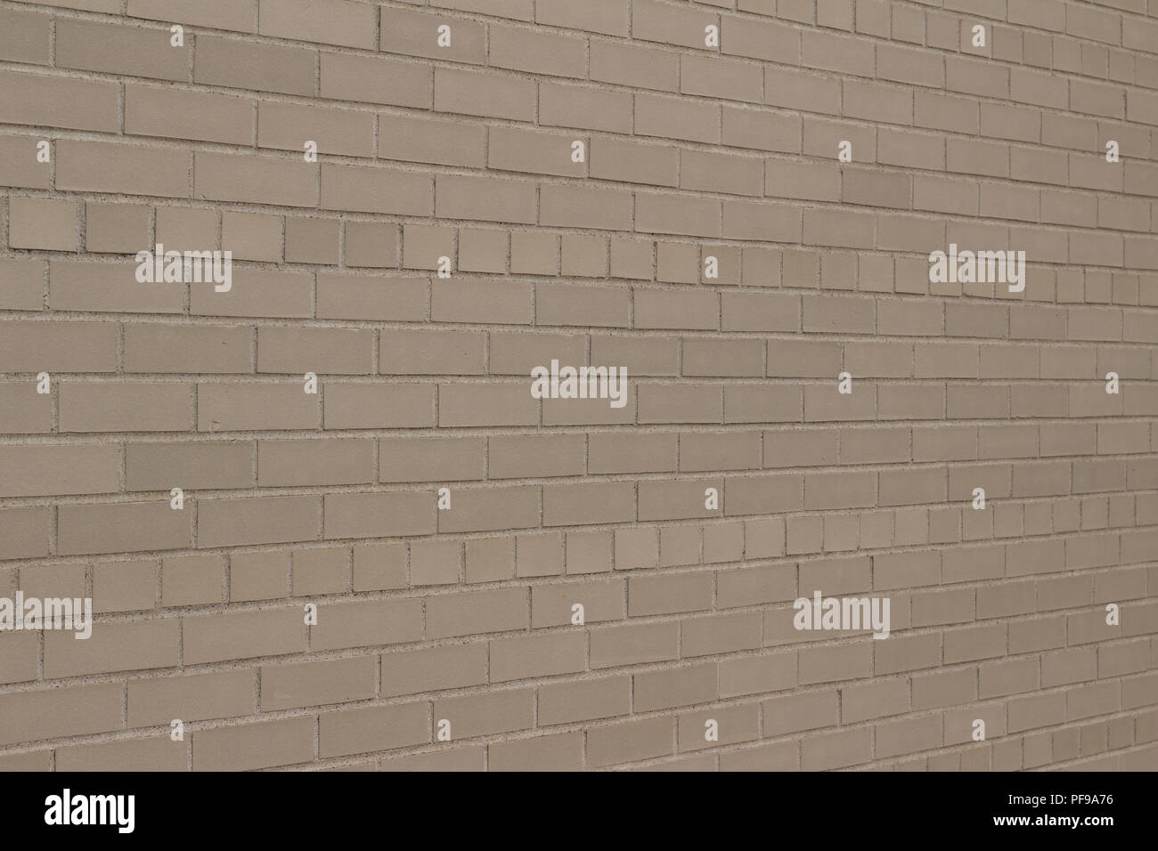 Attractive weathered light grey or beige brick wall background with a ...