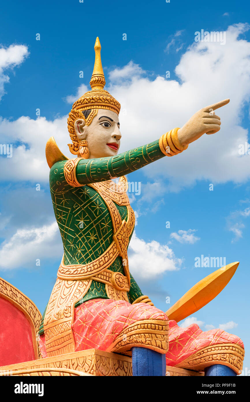 Colorful statue of a man pointing somewhere in Buddhist temple Wat ...