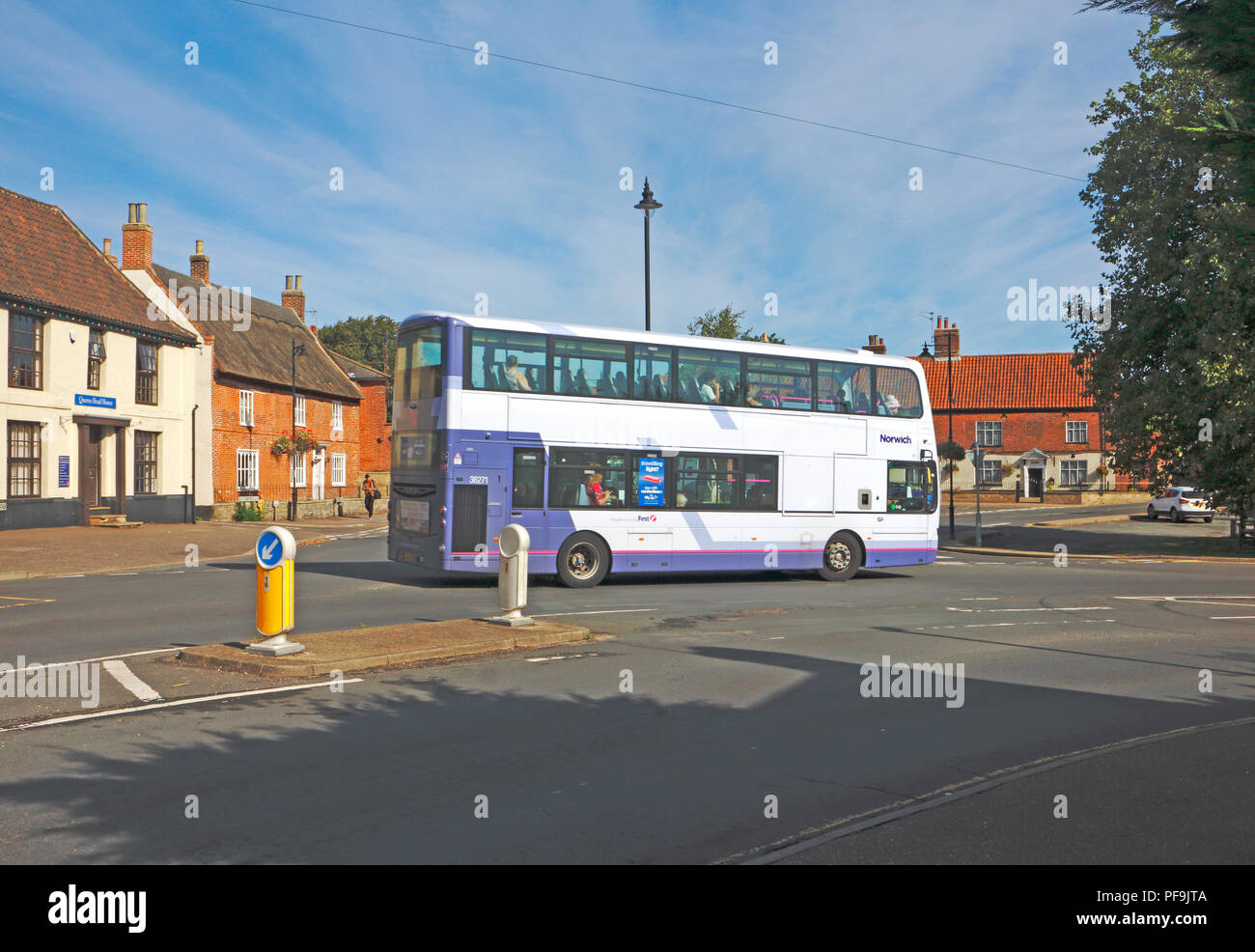 A view of a bus service travelling through the centre of the small ...