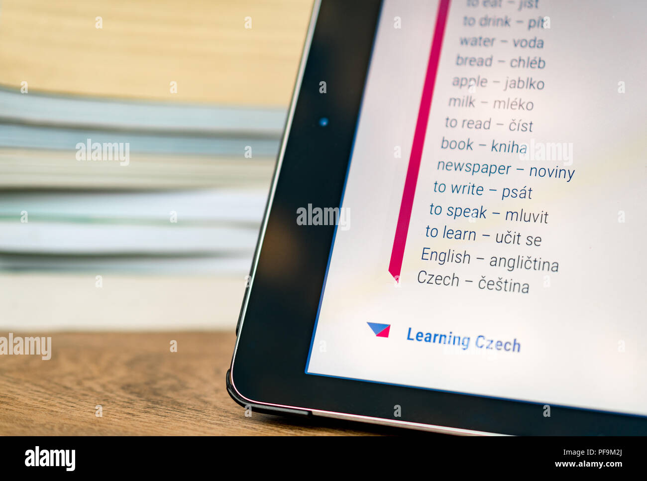 Learning Czech using a tablet with books in the background Stock Photo ...