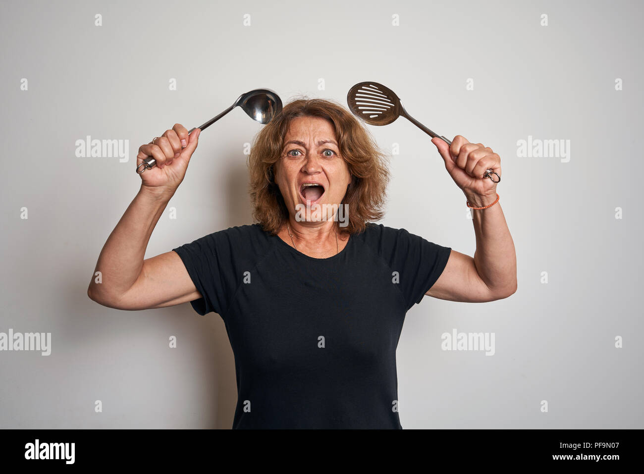 woman with the ladle on white background Stock Photo - Alamy