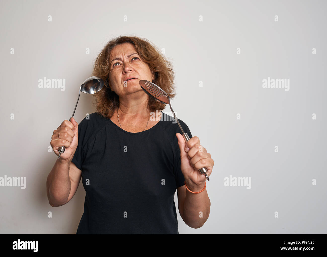 woman with the ladle on white background Stock Photo - Alamy