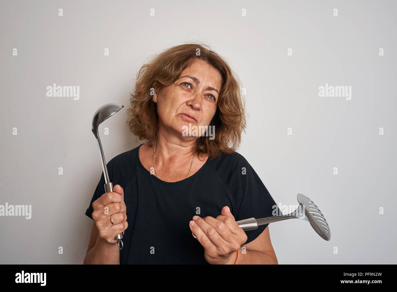 woman with the ladle on white background Stock Photo - Alamy