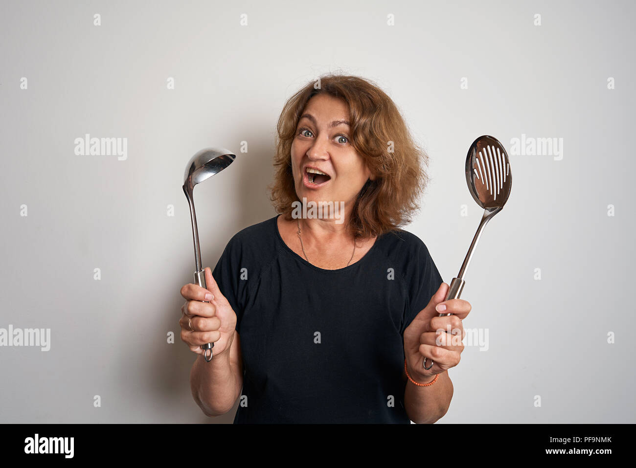 woman with the ladle on white background Stock Photo - Alamy