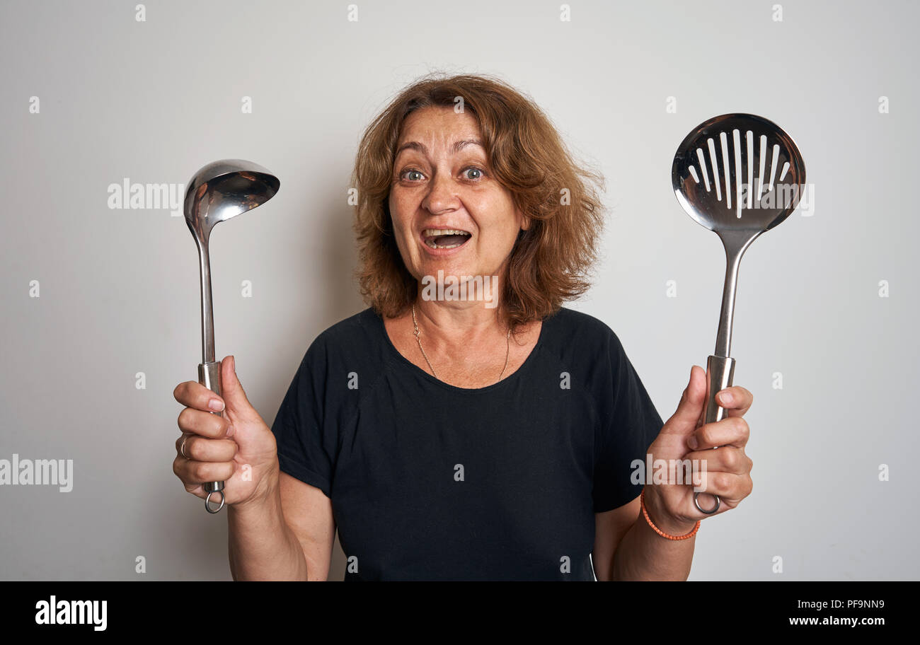 woman with the ladle on white background Stock Photo - Alamy