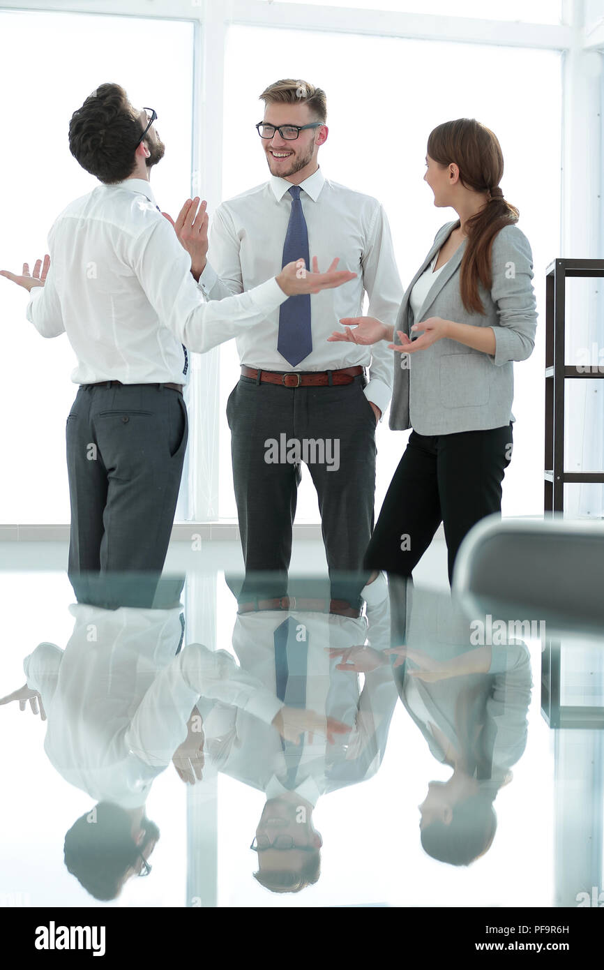 business team talking in an empty office Stock Photo - Alamy