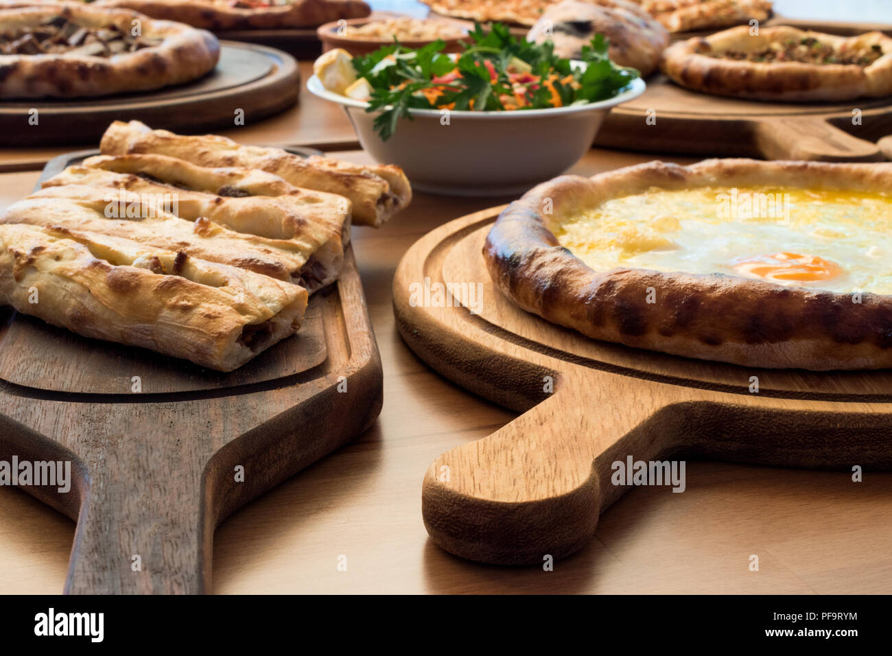 Variety of Turkish Pide Traditional food with beef, Cheese, Fried Egg ...
