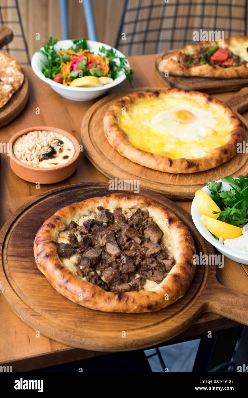 Variety of Turkish Pide Traditional food with beef, Cheese, Fried Egg ...