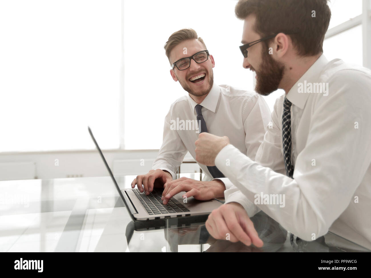 smiling employees at the Desk in the office Stock Photo - Alamy