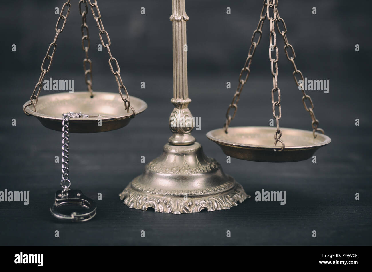Law and Justice, Legality concept, Scales of Justice and handcuffs on a ...