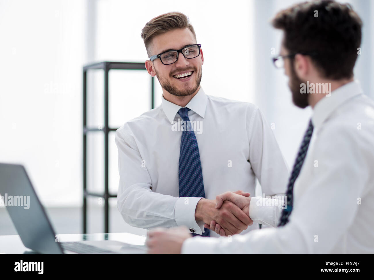 Boss sitting behind desk employees hi-res stock photography and images ...