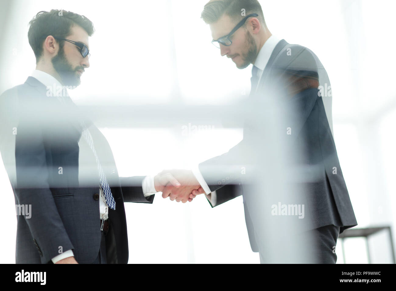 handshake is serious business partners Stock Photo - Alamy