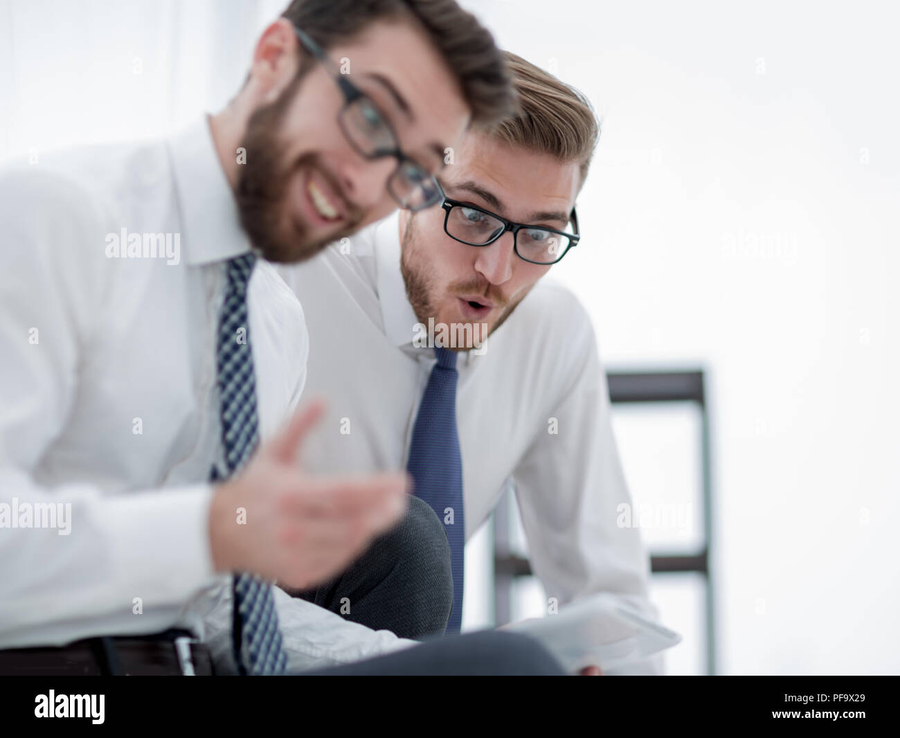 close up.two surprised employees in the workplace Stock Photo - Alamy
