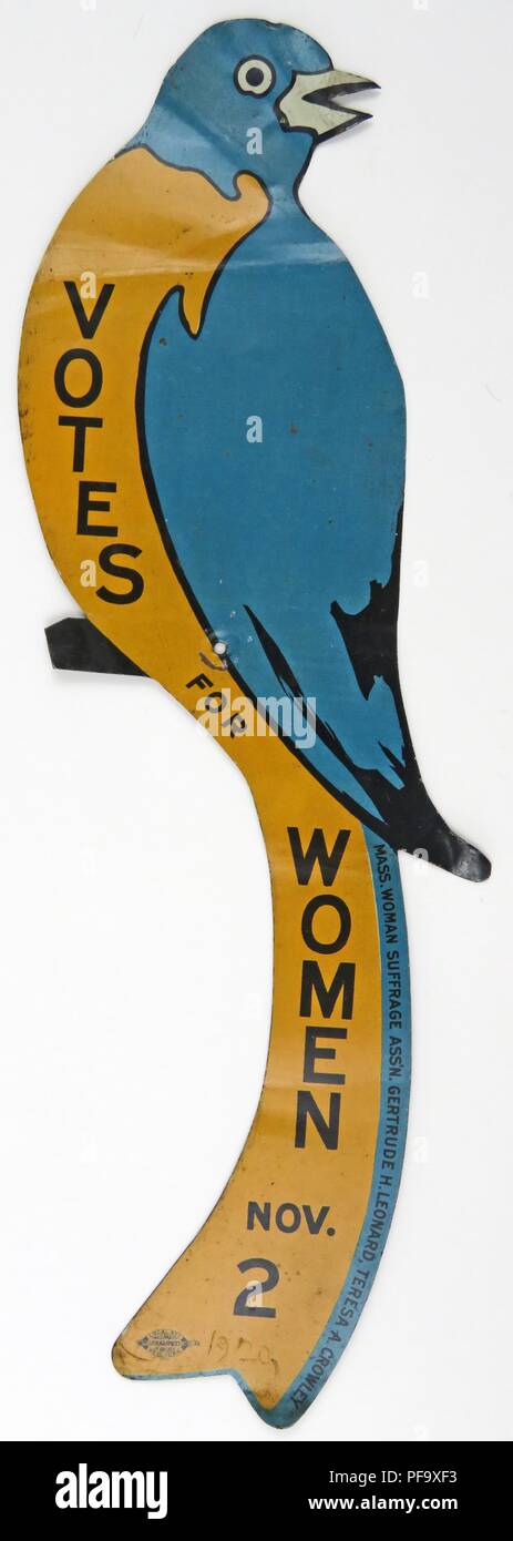 Blue and orange tin bird, with the text 'Votes For Women Nov 2 ...