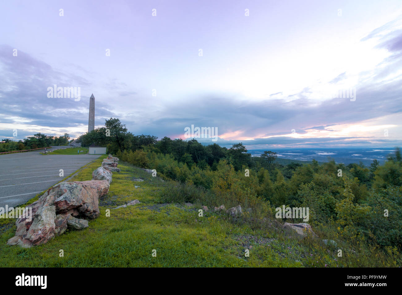 Fog lifts off the Kittatinny Mountains under a stormy sunset at High ...
