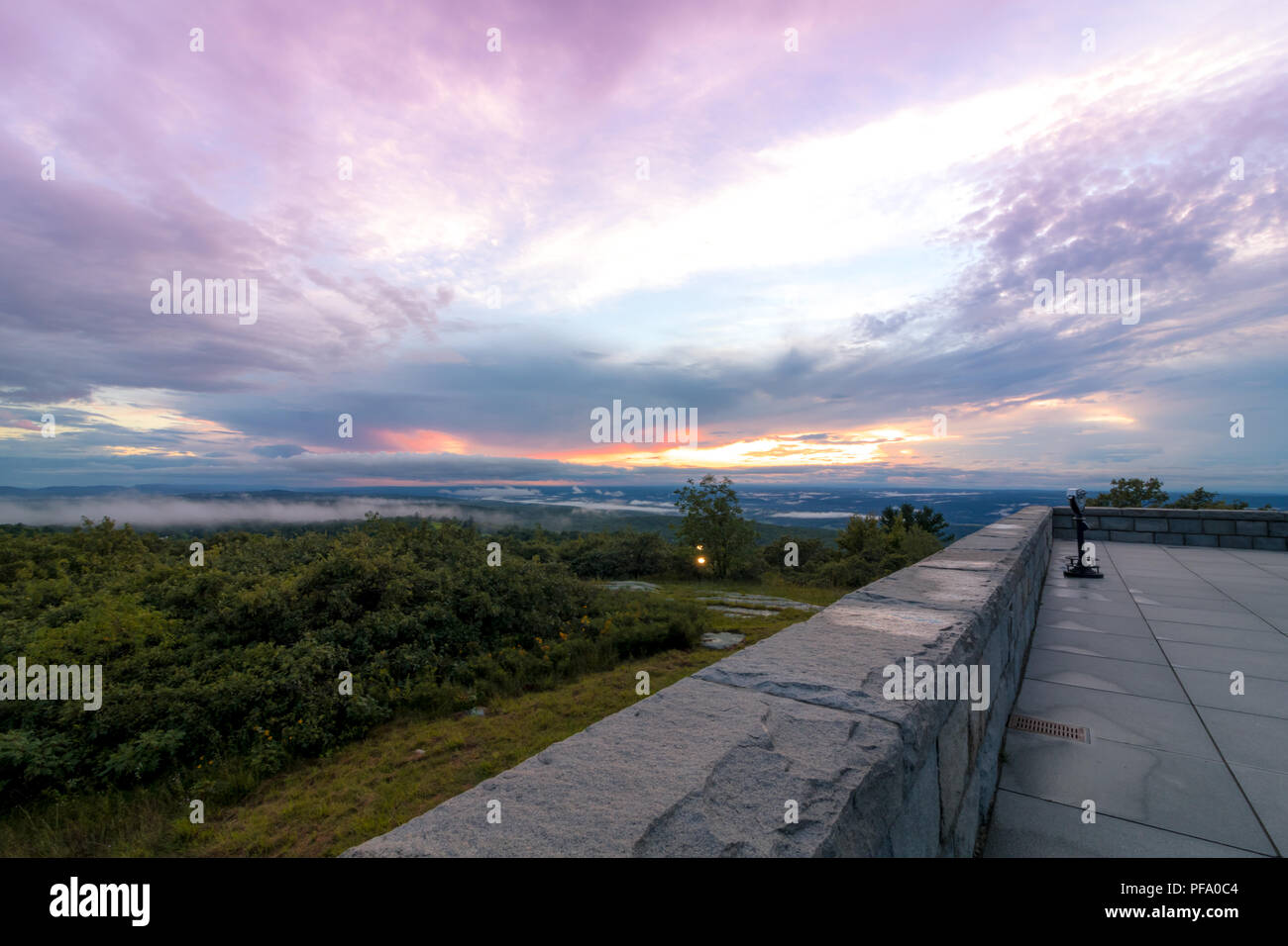 Fog lifts off the Kittatinny Mountains under a stormy sunset at High ...
