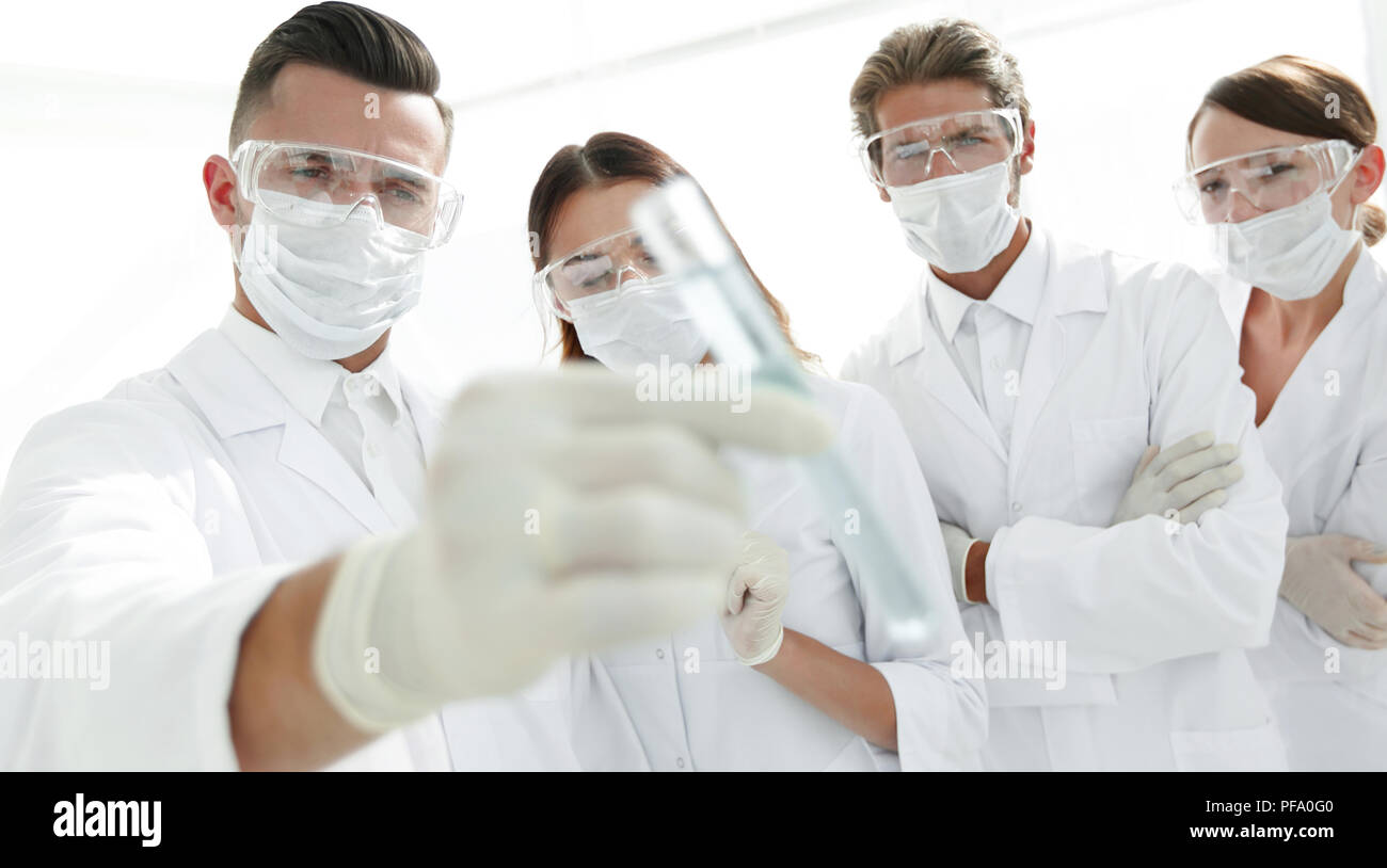 background image is a group of medical workers working with liquids in ...