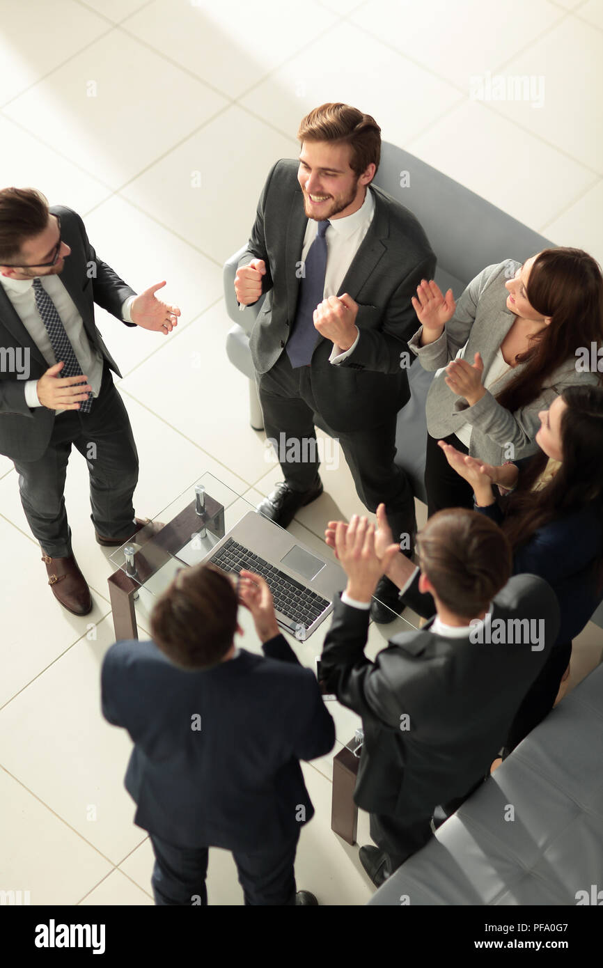 Professional colleagues high fiving hi-res stock photography and images ...