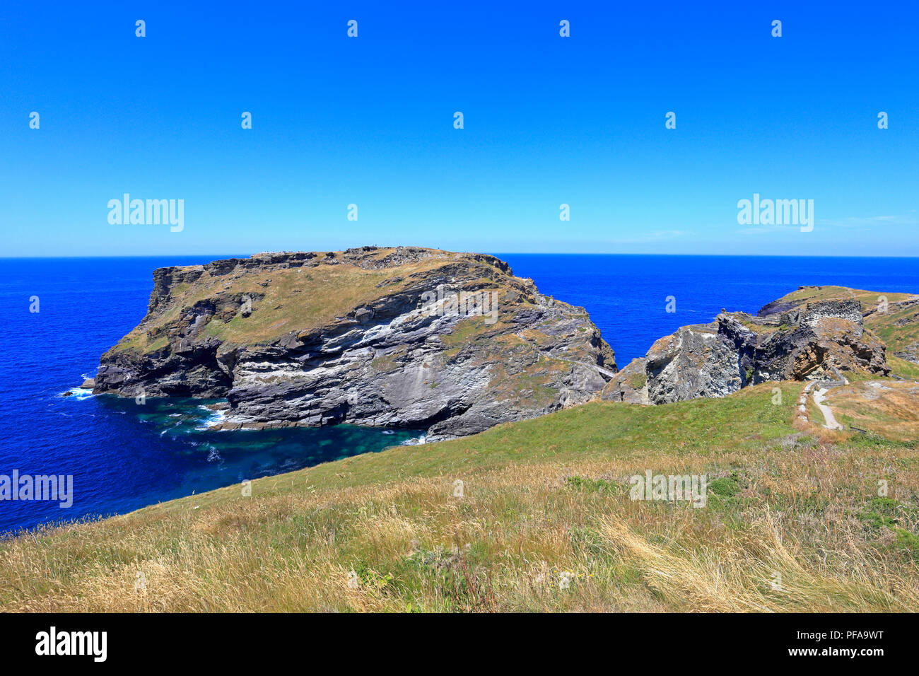 The ruins of Tintagel Castle on the peninsula of Tintagel Island from ...