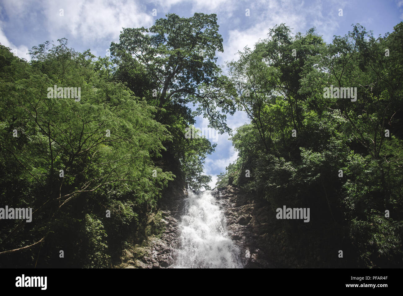 Water begins to fall from the top of Montezuma Waterfall, a popular ...