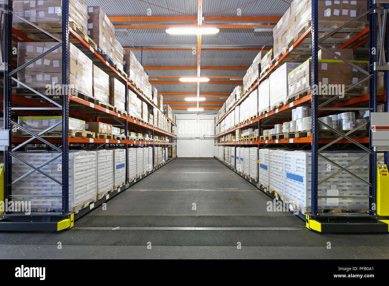 Big storage room for goods in factory Stock Photo - Alamy