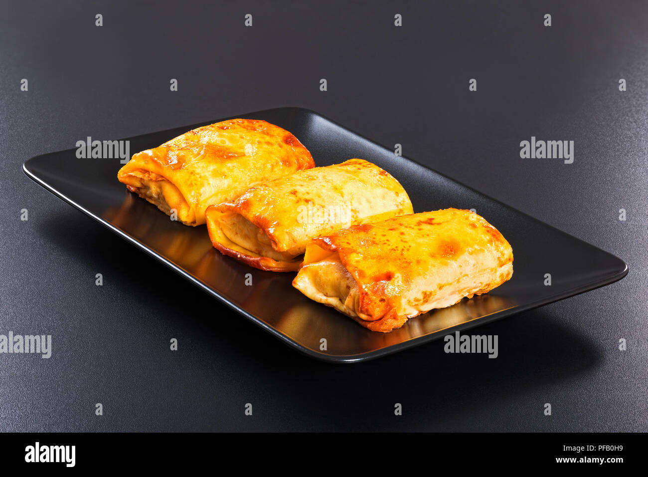 rolled pancakes or crepes stuffed with minced meat and vegetables on ...