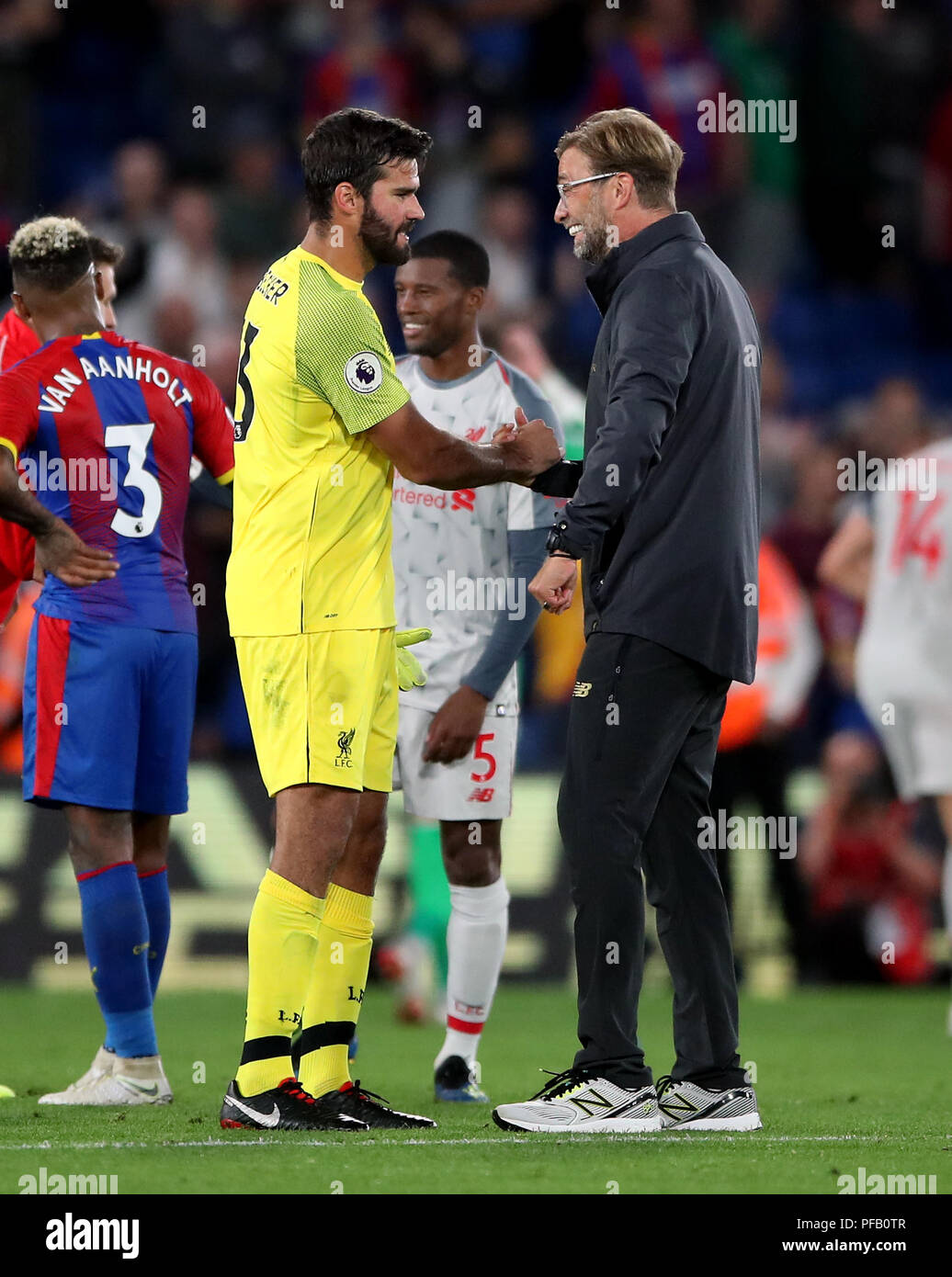 Liverpool manager Jurgen Klopp celebrates with goalkeeper Alisson ...