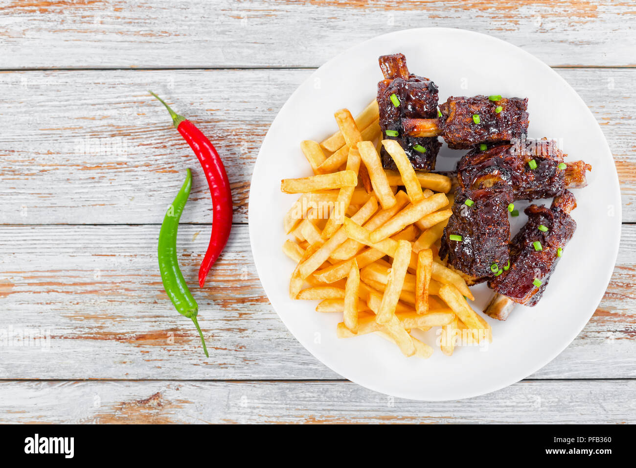french fries with fried sticky ribs marinated in soy sauce and ginger ...