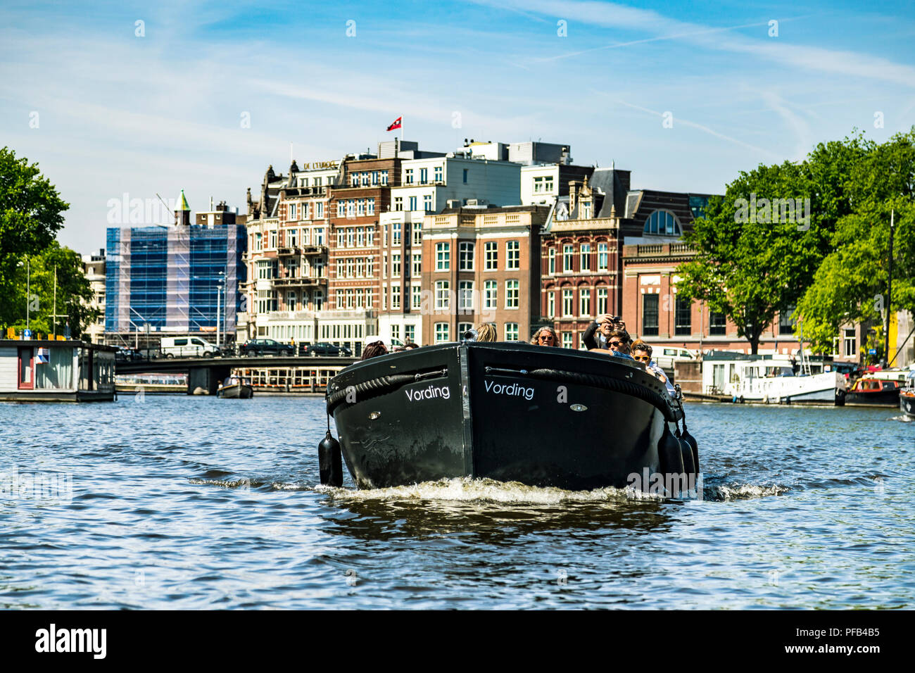 Tourists boating on the Amsterdam canals, Netherlands Stock Photo - Alamy