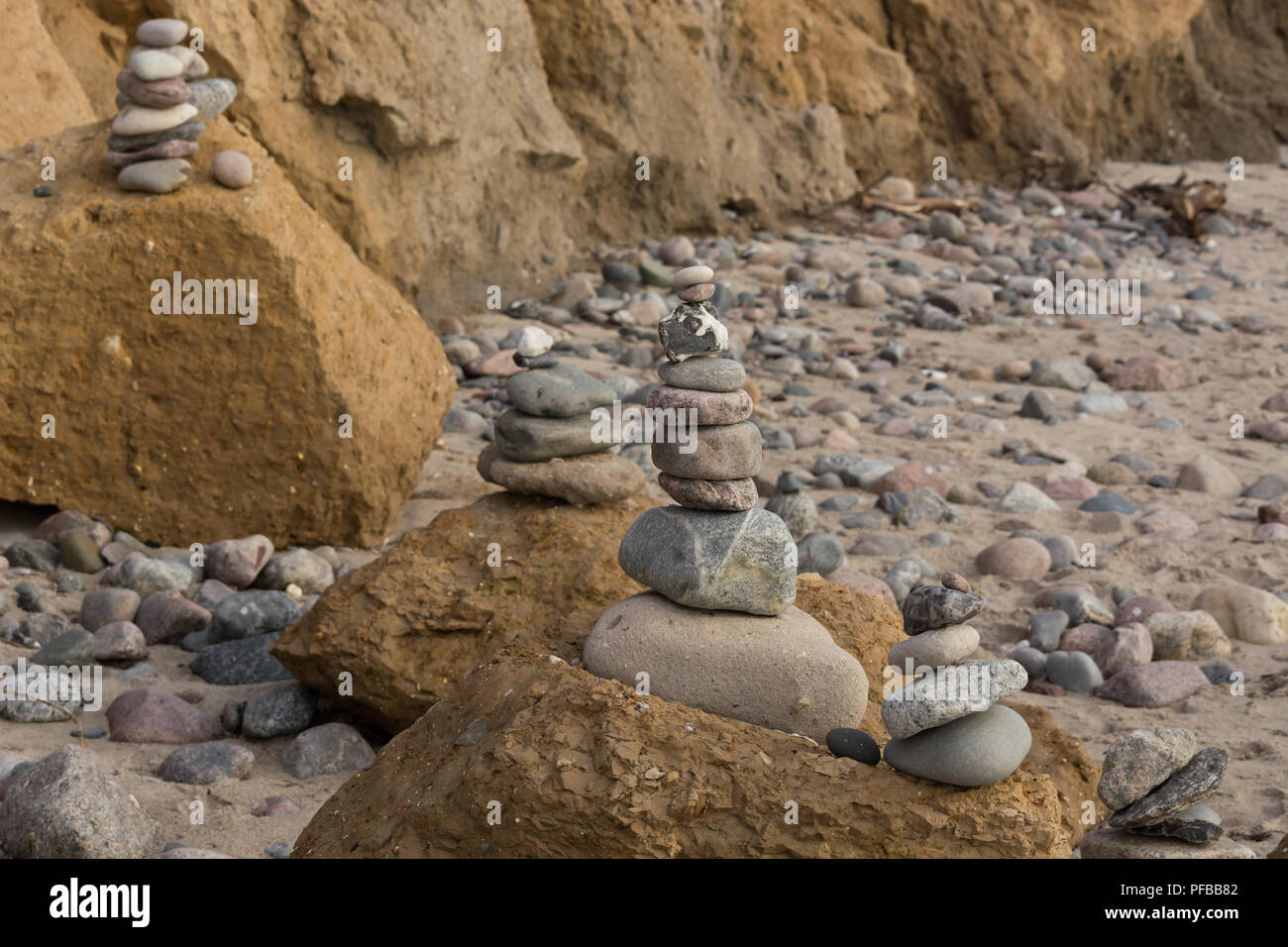 Stones stacked on top of each other on the beach in the background the ...