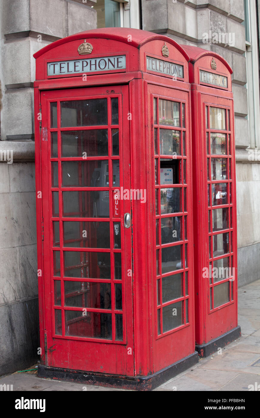 Two traditional iconic red British telephone boxes in London Stock ...