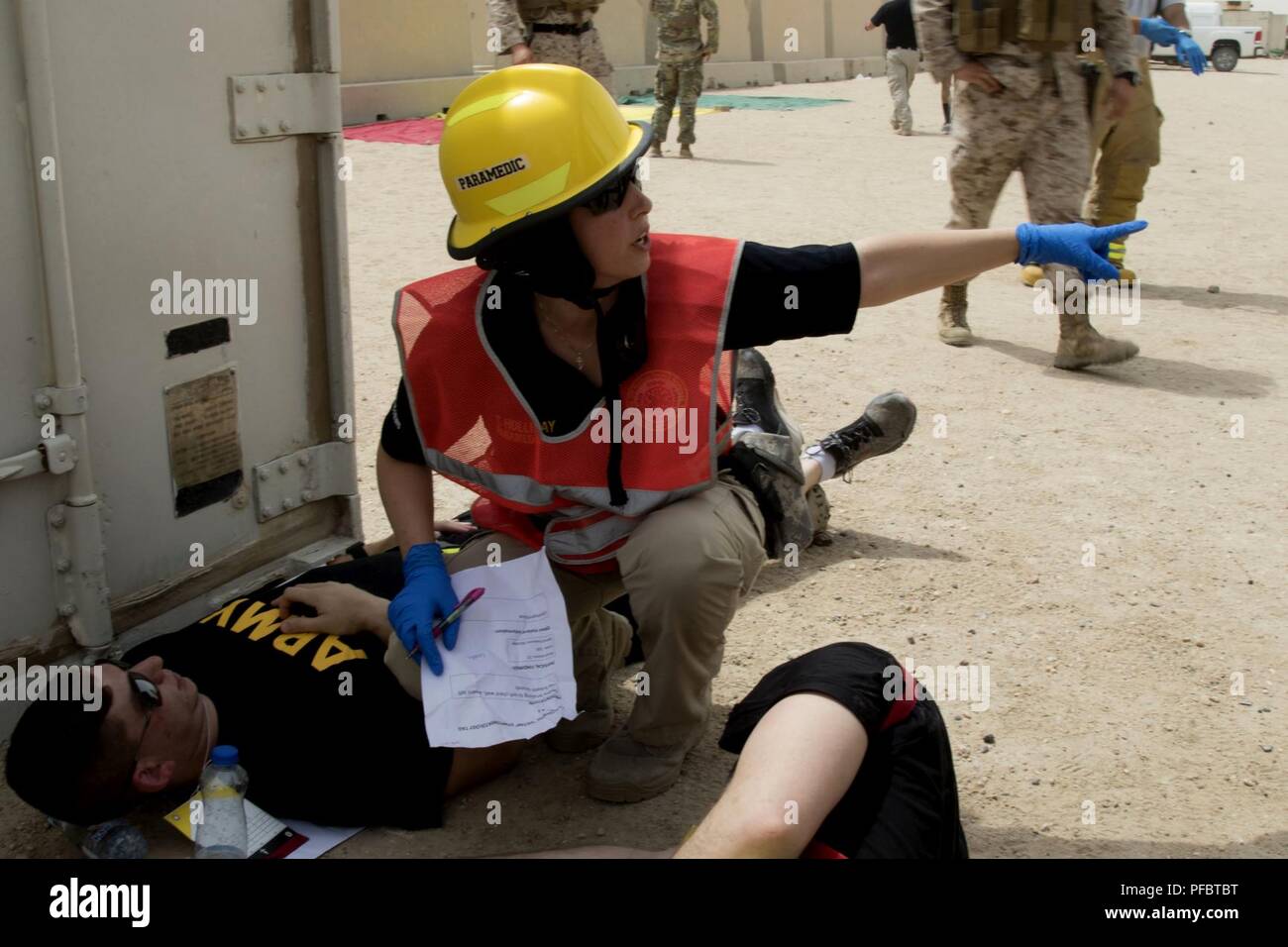 A paramedic treats Soldier from the 2nd Brigade of the 1st Armored ...