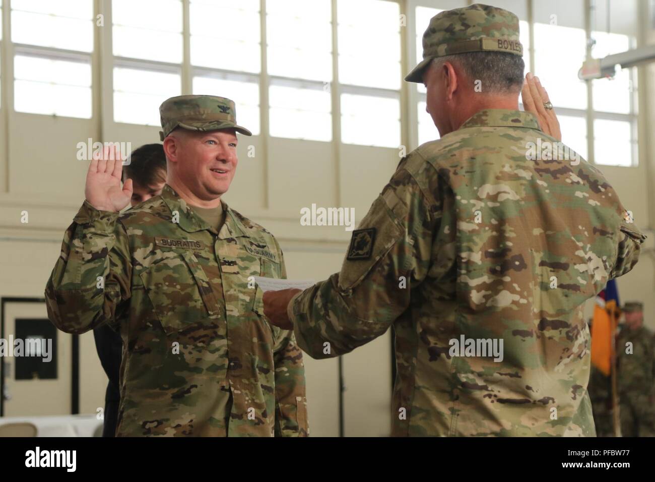 Col. Stanley Budraitis takes the oath of office administered by Maj ...