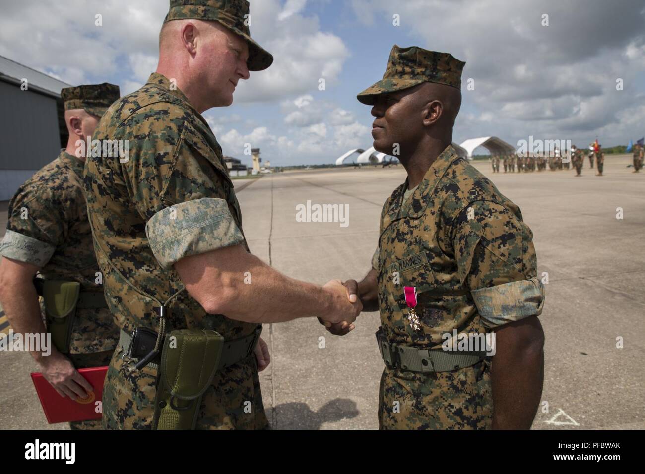 Brig. Gen. Bradley S. James, left, commander of 4th Marine Aircraft ...