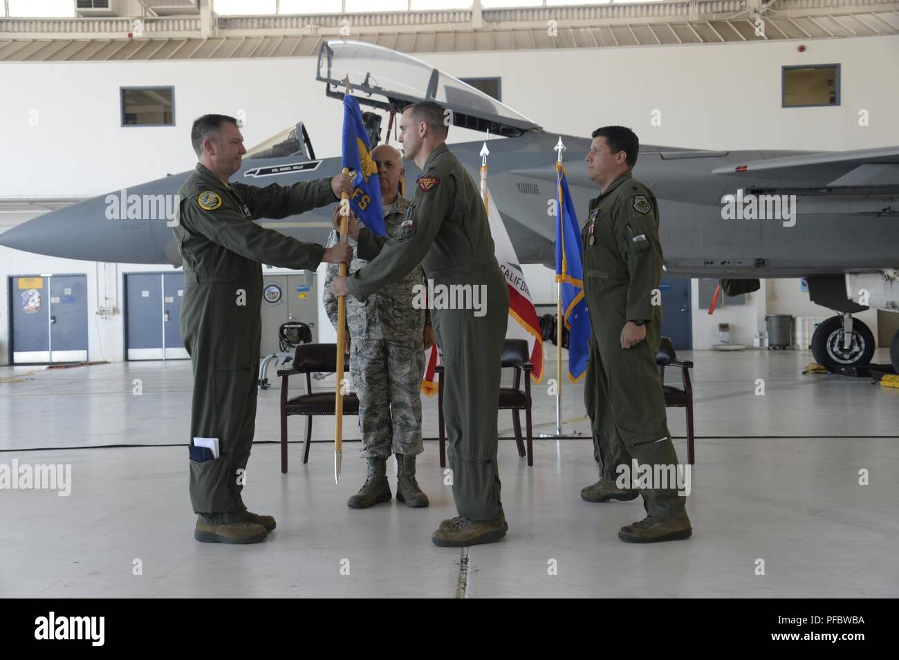 U.S. Air Force Lt. Col. Christopher Ridlon, incoming 194th Fighter Squadron commander, accepts ...