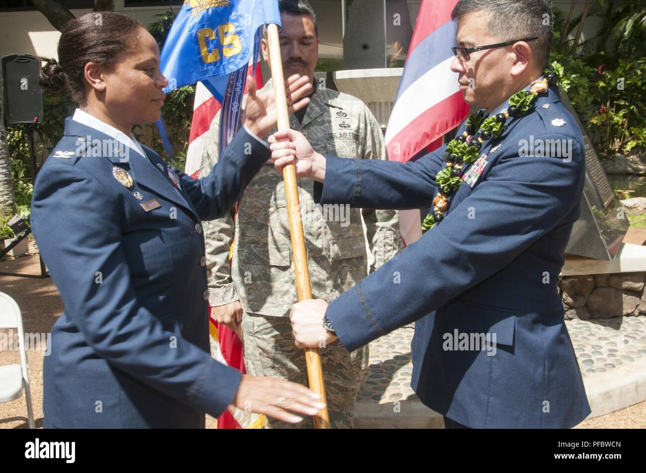 Col. Joyce Merl, commander, 154th Mission Support Group, receives the ...