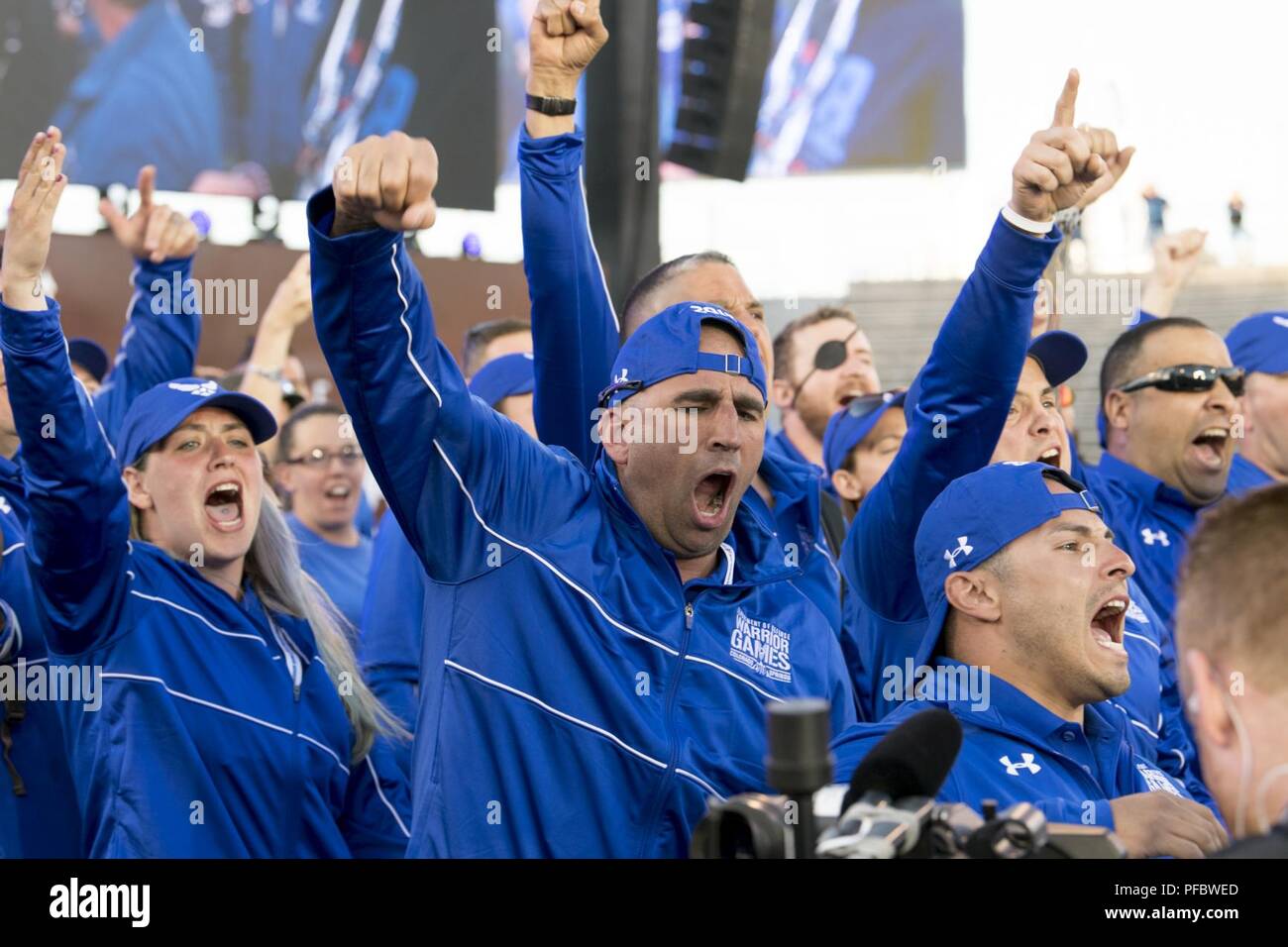 Team Air Force gives a cheer upon entering opening ceremonies for the ...