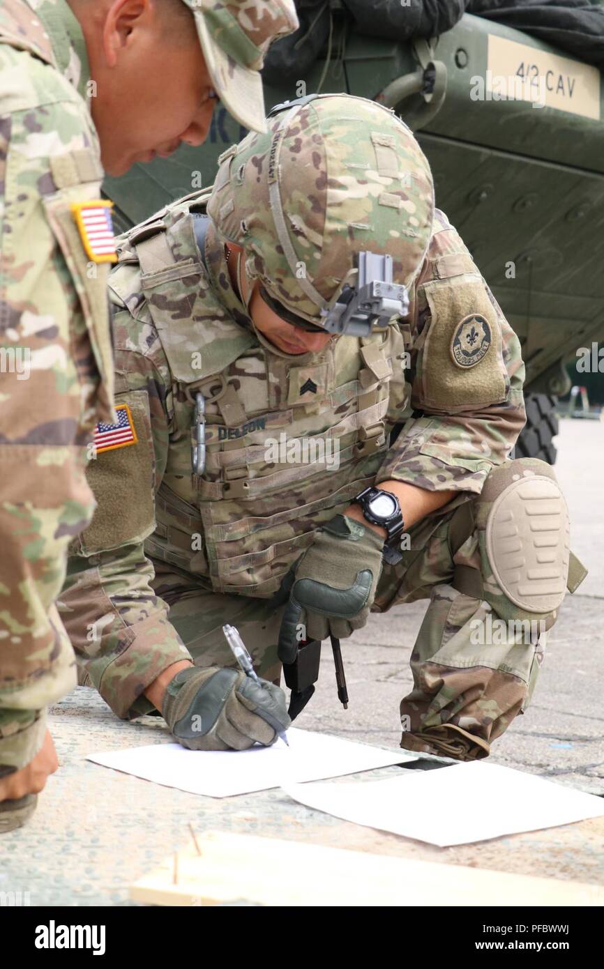 A Soldier in 4th Squadron, 2d Cavalry Regiment, signs for training ...