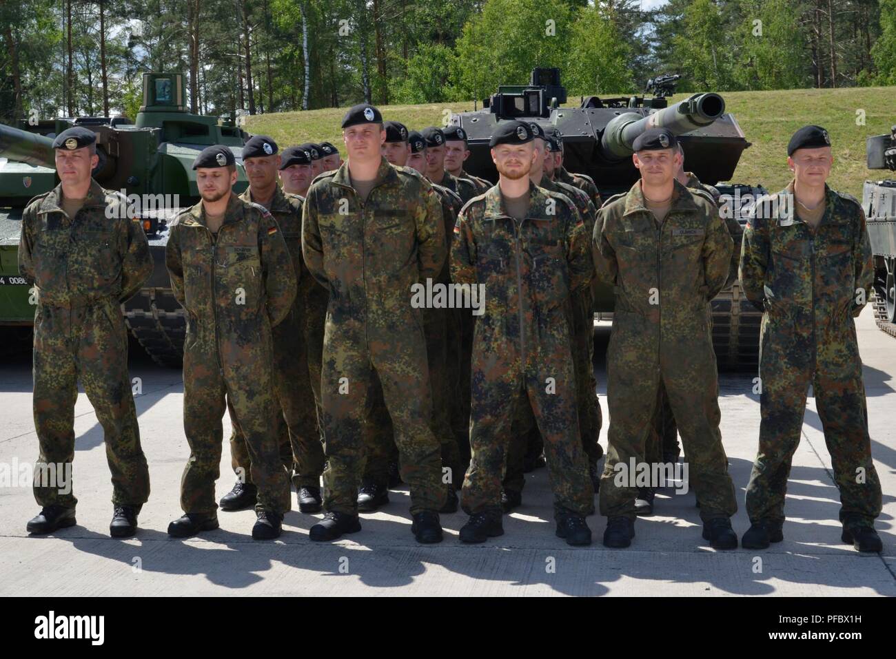 German tankers, assigned to 3rd Panzer Battalion, pose in front of ...