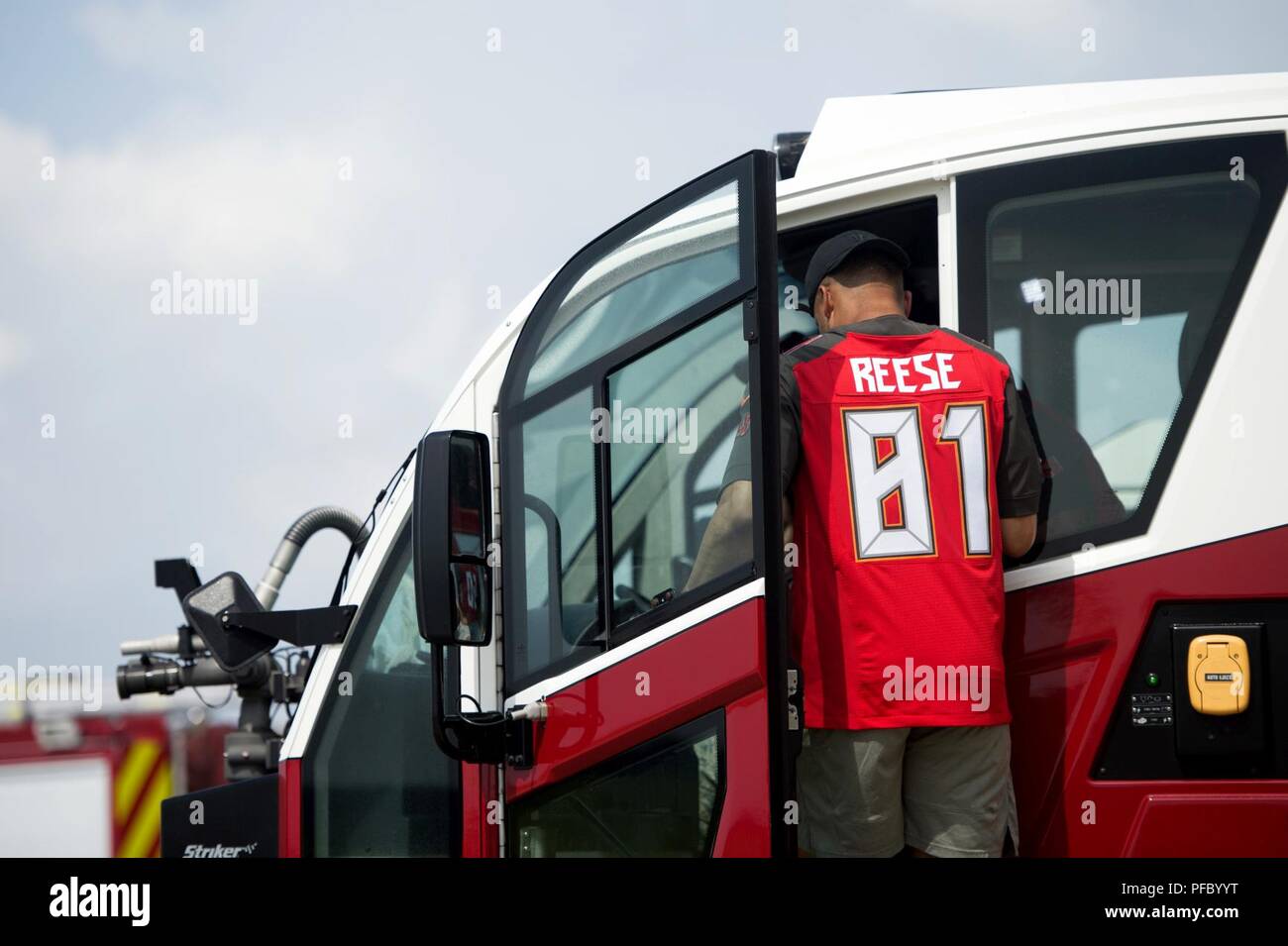 Tampa Bay Buccaneers Jason Reese, a tight end, gets into a fire truck ...