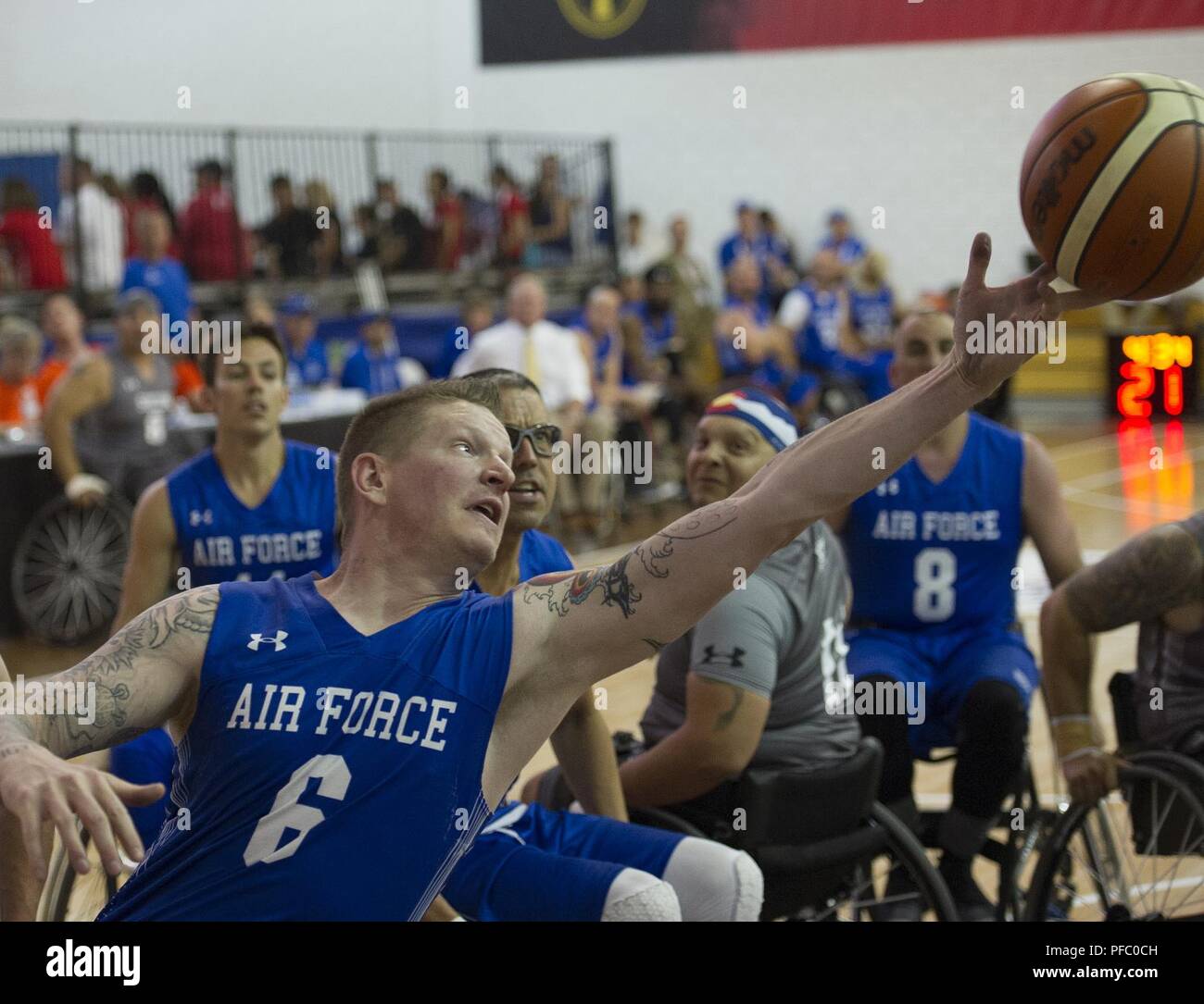U.S. Air Force Staff Sgt. Brent Young reaches for the basketball after ...