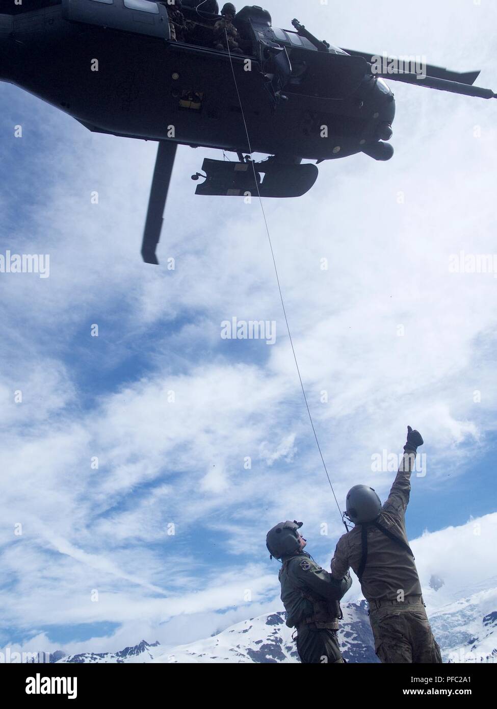 Crew of a 210th Rescue Squadron HH-60G Pave Hawk hoist Chief Master Sgt ...