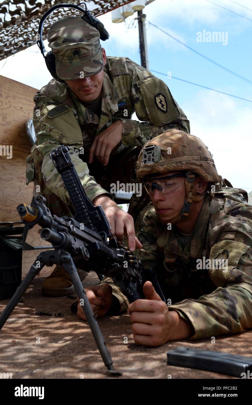 Sgt. Tyler McKay (sitting), an infantryman assigned to 2nd Battalion ...