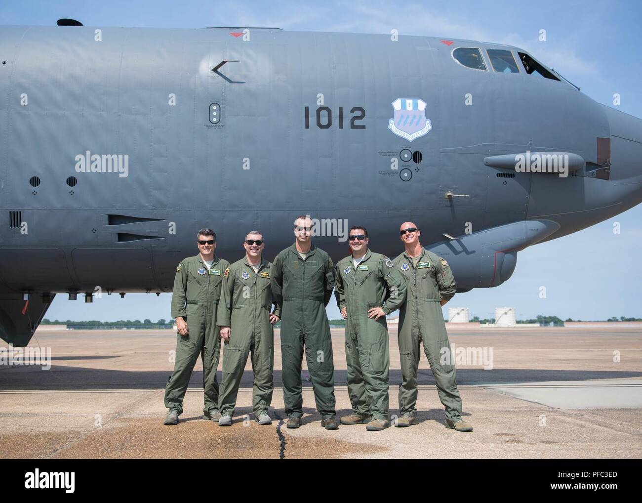 Col. Ty Neuman (center), 2nd Bomb Wing commander, poses for a photo ...