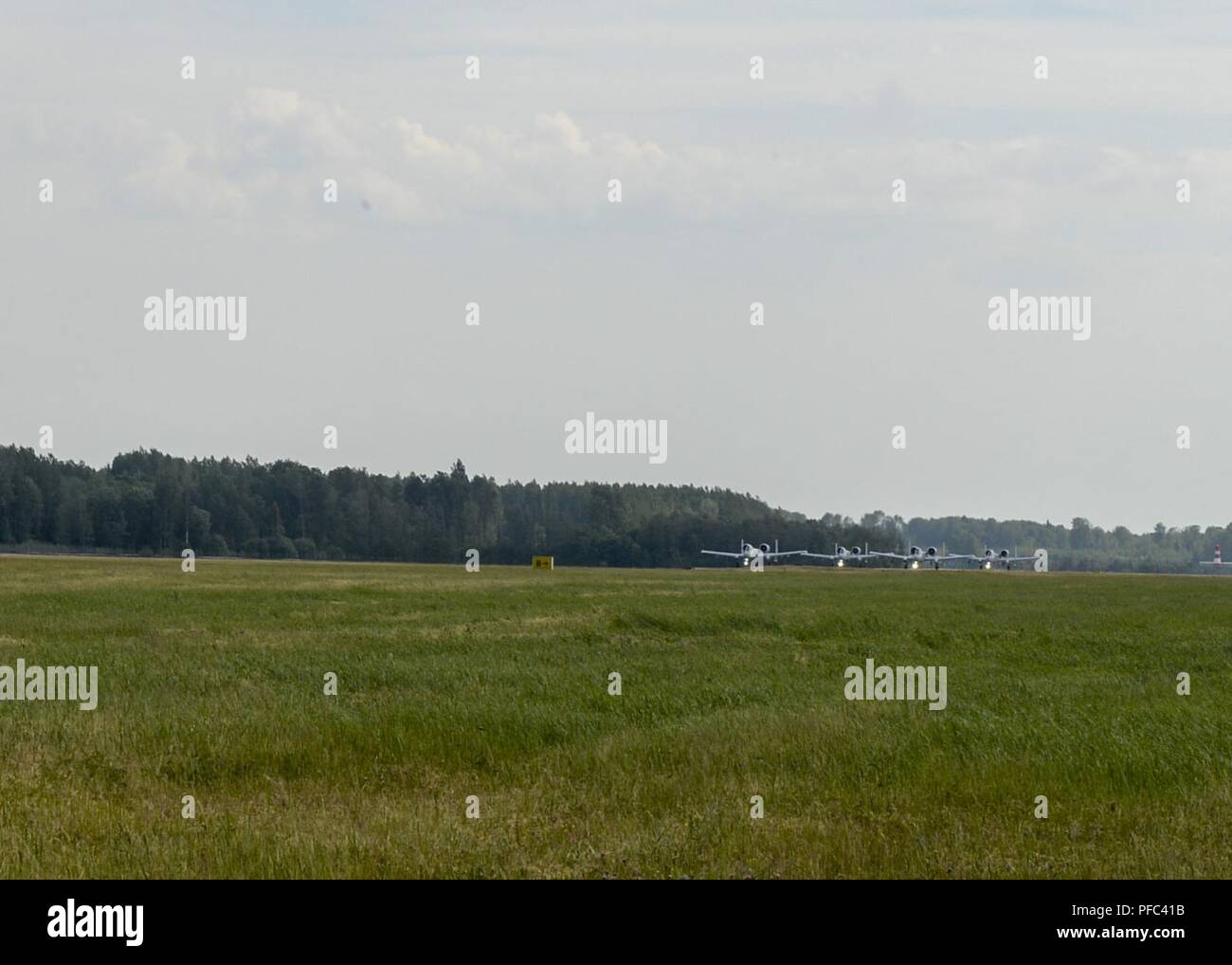 Four A-10 Thunderbolt IIs prepare for takeoff at Lielvarde Air Base ...