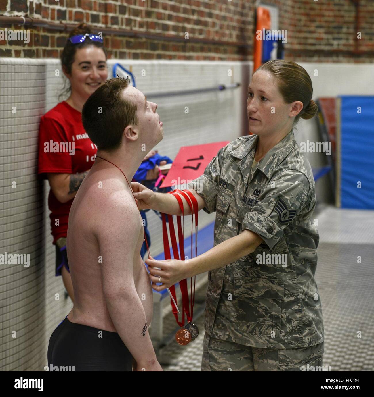 Staff Sgt. Beverly C. Meijers presents her brother, Simon Cole, with an ...
