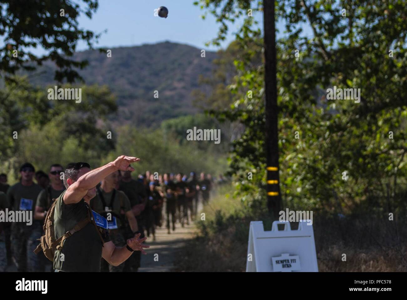 Marines and Sailors participate in the obstacle, “Fire in the Hole ...