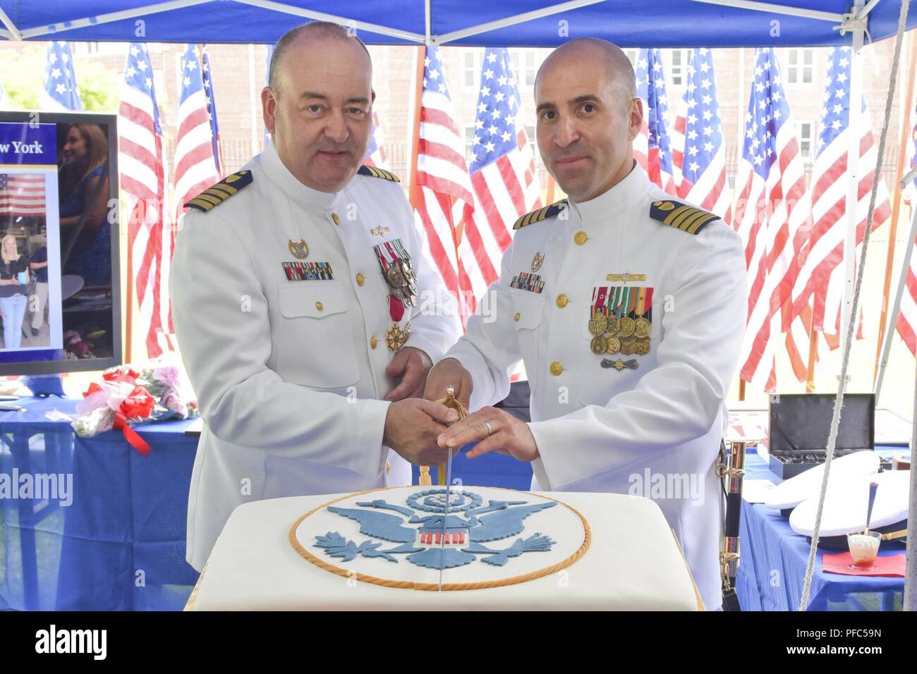 Capt. Michael Day (left) and Capt. Jason Tama (right) prepare to cut ...